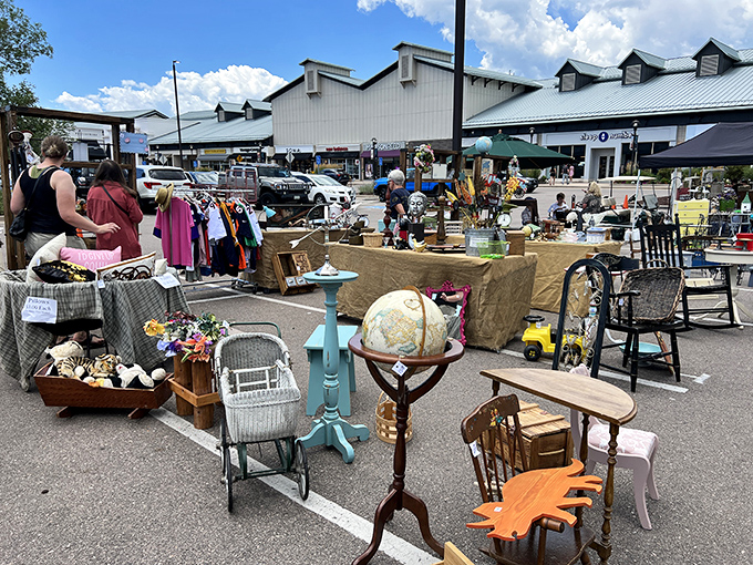 Antique furniture under blue skies&mdash;like shopping in a fancy outdoor living room where everything's for sale.