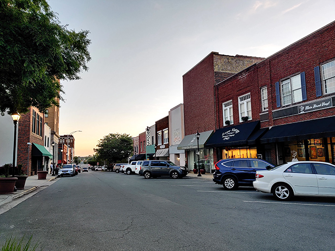 Stroll through Burlington's charming downtown, where the historic brick storefronts and golden hour glow invite you to explore and stay.