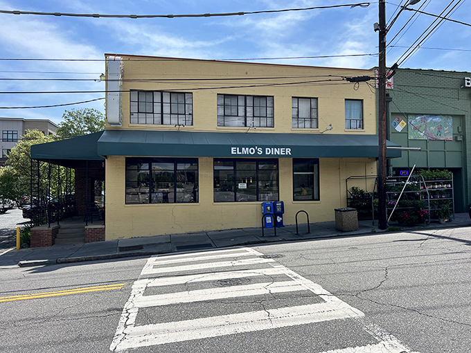 Elmo's sunny yellow building stands proud on the corner, a beacon for breakfast lovers and comfort food seekers.