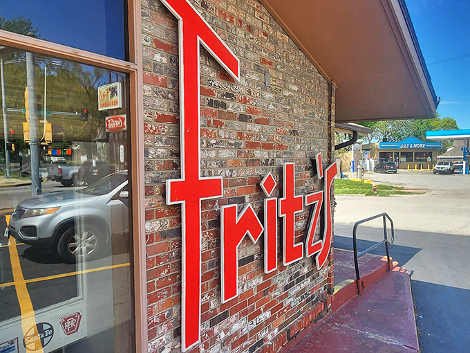 Fritz's bold red lettering stands out like a conductor's warning: Prepare for a burger experience that comes with its own train set!