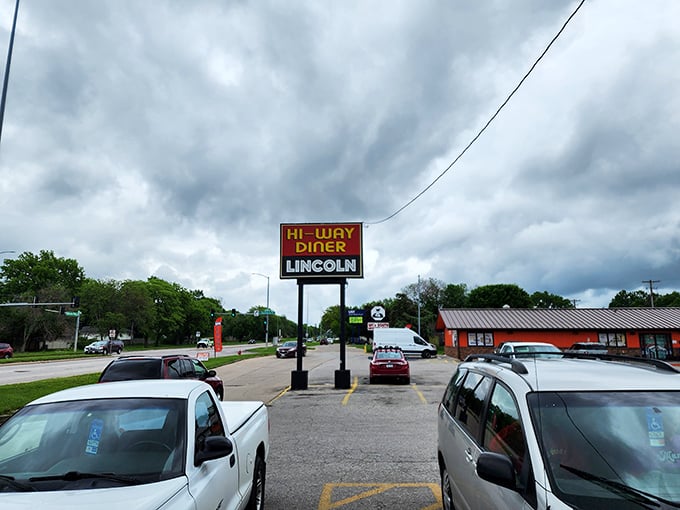 Hi-Way Diner's sign stands tall against Nebraska skies, a beacon for those seeking breakfast salvation at any hour.