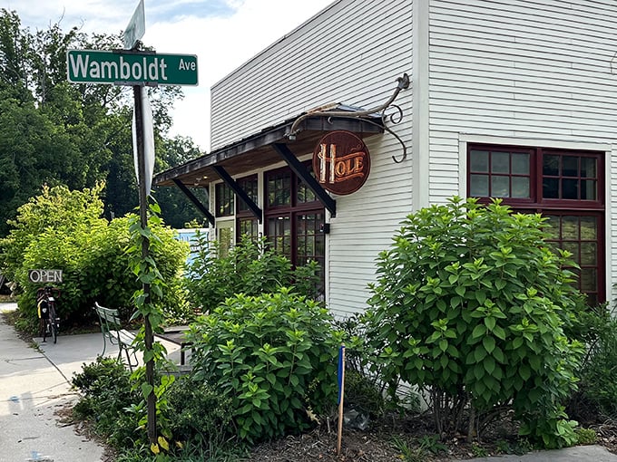 Hole Doughnuts' charming white building with red windows looks like a storybook cottage that happens to serve incredible donuts.