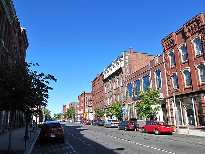 Holyoke's colorful streetscape pops with vibrant murals, where string lights crisscross overhead like stars you can almost reach.