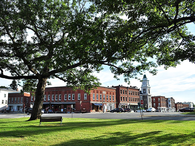 Litchfield's historic district features a clock tower rising above brick buildings that have witnessed centuries of small-town life.