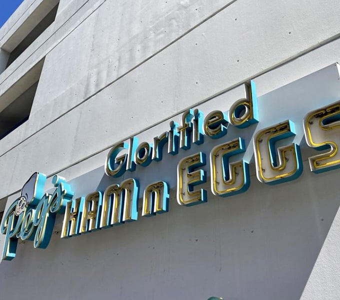 Peg's turquoise sign glows with retro charm, much like the feeling you'll get when your glorified breakfast arrives at the table.