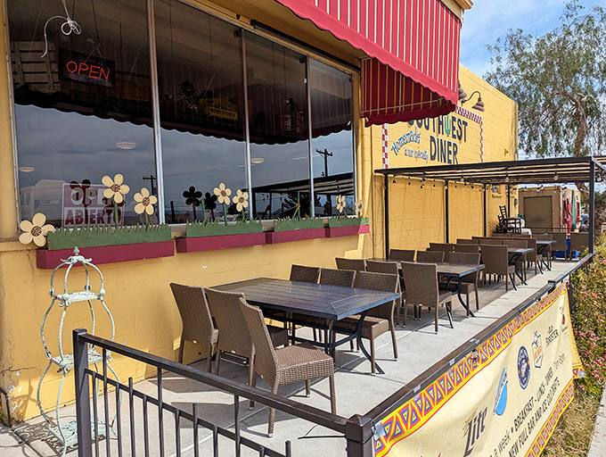 Southwest Diner's cheerful yellow exterior and outdoor seating – breakfast with a side of Boulder City sunshine.