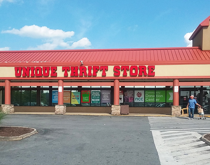 Unique Thrift Store lives up to its name with a bold red sign that promises adventure. The thrill of discovery awaits!