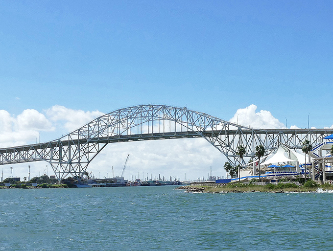 The Harbor Bridge spans Corpus Christi Bay like a giant steel rainbow leading to affordable coastal adventures.