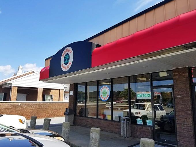 The red awning and retro vibe aren't just decoration &ndash; they're time machines to when donuts were simpler and somehow better.