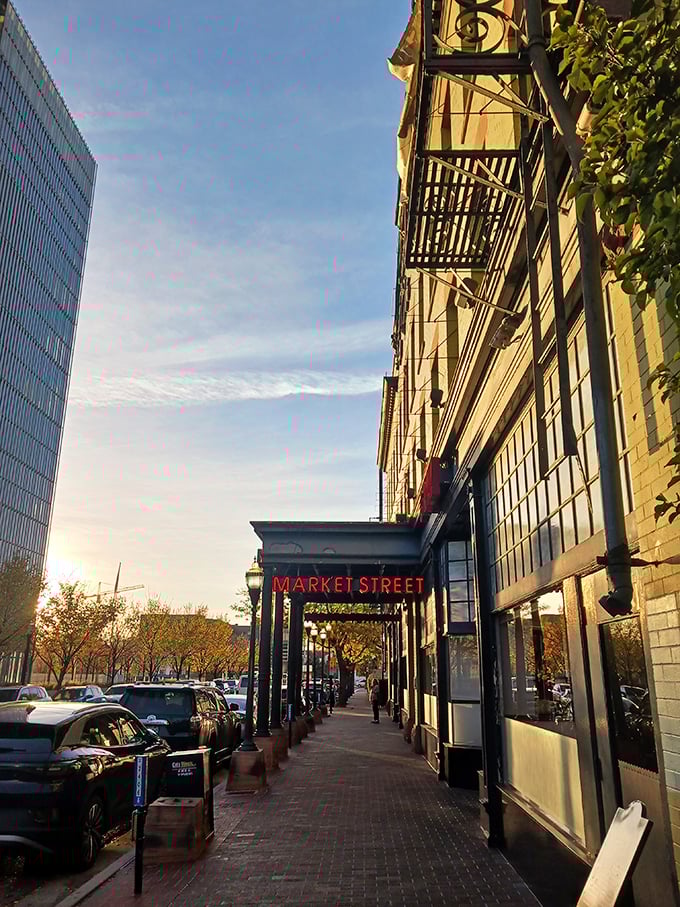 The golden hour glow on Market Street's entrance promises seafood treasures within. Follow that neon sign to flavor town!