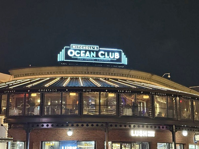 Mitchell's Ocean Club: Where nighttime dining becomes a glowing experience. That illuminated sign is like a lighthouse guiding hungry sailors to port.