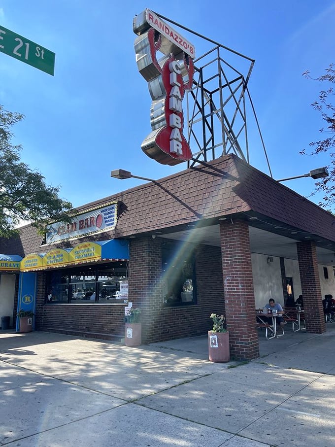 That vertical "CLAM BAR" sign isn't just advertising—it's a Brooklyn landmark that's witnessed countless seafood celebrations.