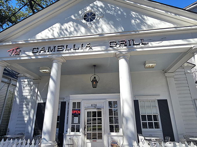 That bright pink bench is where friendships are formed while waiting for omelets that deserve their own parade.