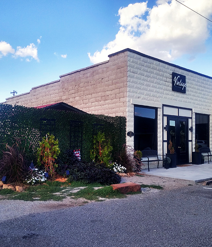 Simple black doors against white brick&mdash;Morrison's little steakhouse proves greatness doesn't need flashy advertising.