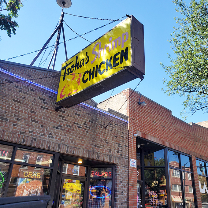 Sunshine yellow by day, neon paradise by night. Troha's simple brick exterior hides Chicago's crispiest shrimp and chicken treasures.