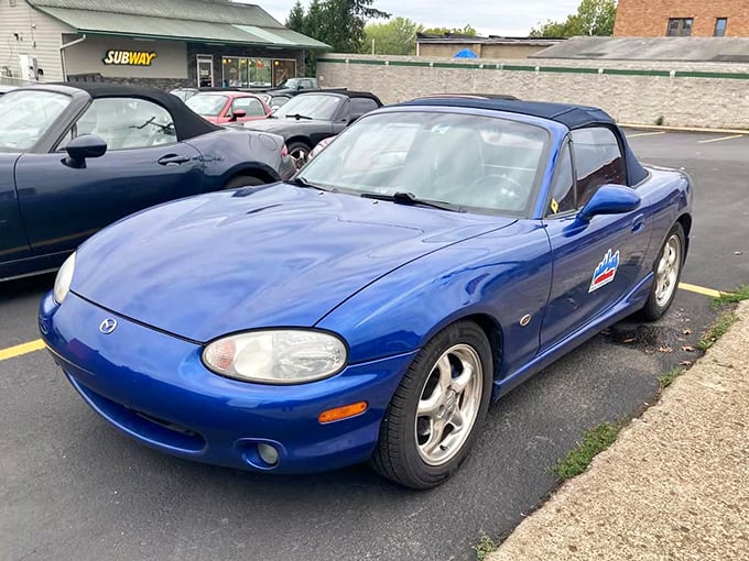 The sporty blue Miata might be the youngster in this collection, but it carries the torch of pure driving joy that connects generations of enthusiasts.