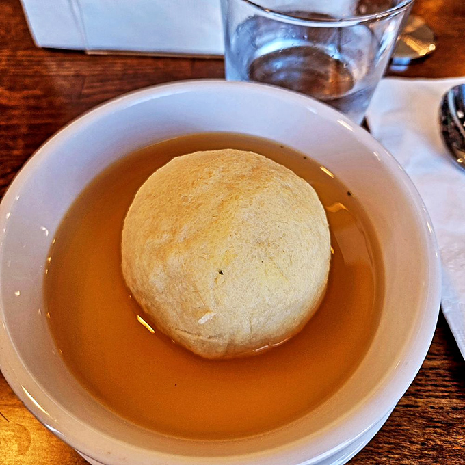 Golden broth cradling a perfect matzo ball&mdash;the deli equivalent of Michelangelo's David. A soup that demands a moment of silence.