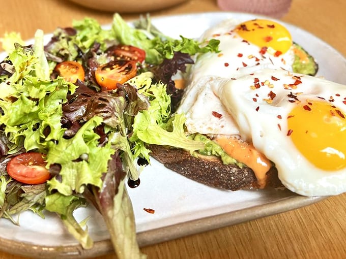 Two sunny eggs perched atop avocado toast like breakfast royalty&mdash;a dish so photogenic it probably has its own Instagram following.