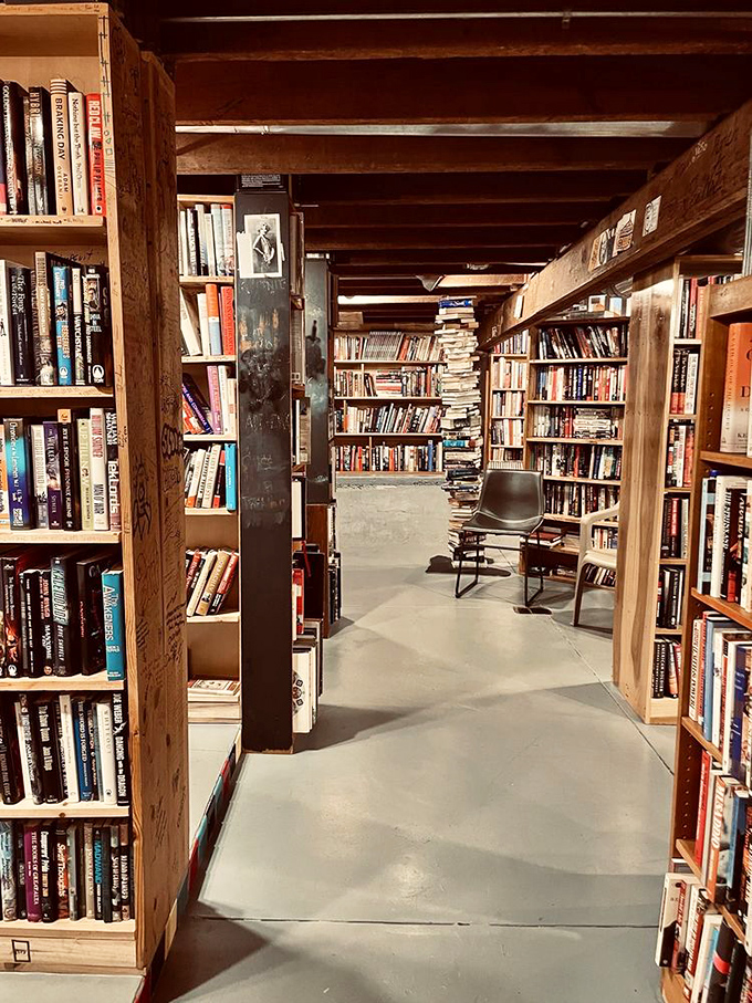 The basement level reveals another literary universe. These raw wooden beams have witnessed countless readers finding their next favorite book.