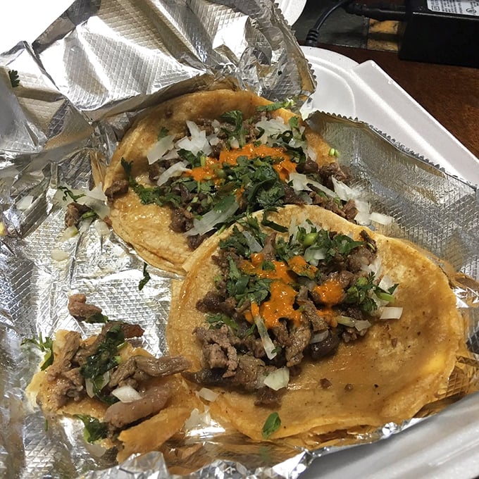 Three beef tacos, simply dressed with cilantro and onion&mdash;proof that when ingredients are this fresh, culinary restraint becomes an art form.