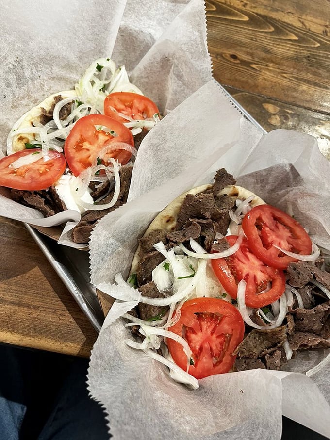 Two gyros, twice the pleasure. These paper-wrapped bundles of joy prove that sometimes the best things in life come in simple packages.