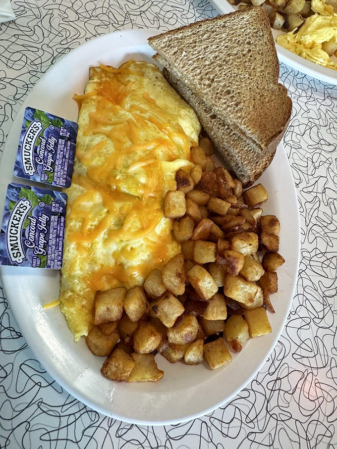 Cheese doesn't melt&mdash;it surrenders completely to this omelet. Those home fries are the supporting actors deserving their own Academy Award.