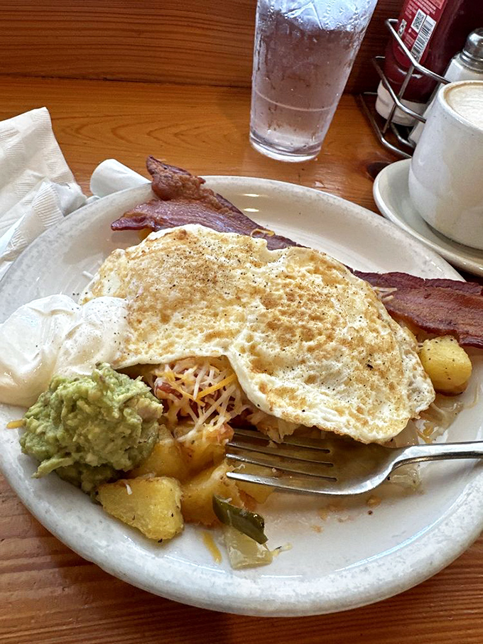 Every breakfast platter tells a story, but this one&mdash;with its perfect eggs, crispy bacon, and avocado&mdash;is writing a love letter to your taste buds.