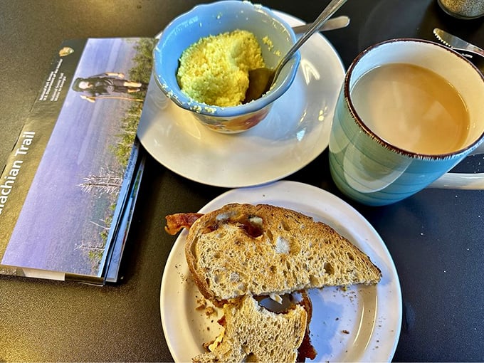 Morning salvation arrives in the form of perfectly toasted bread, a cup of steaming coffee, and the promise of a better day ahead.