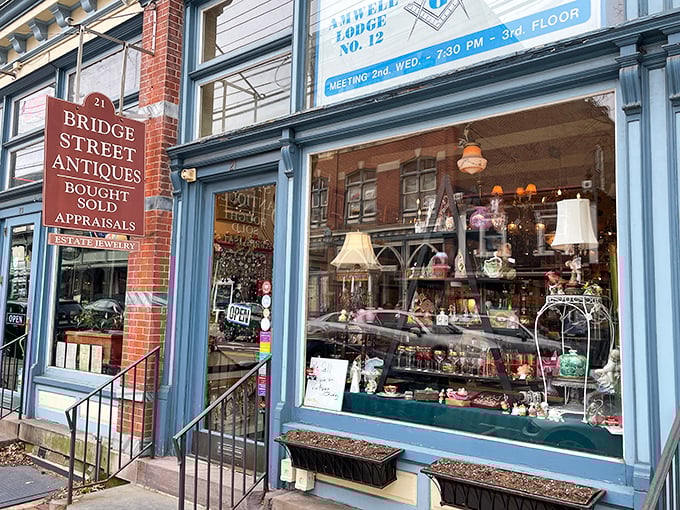 Bridge Street Antiques' blue fa&ccedil;ade houses carefully curated collections where every teacup, lamp, and curiosity has survived decades to meet you.