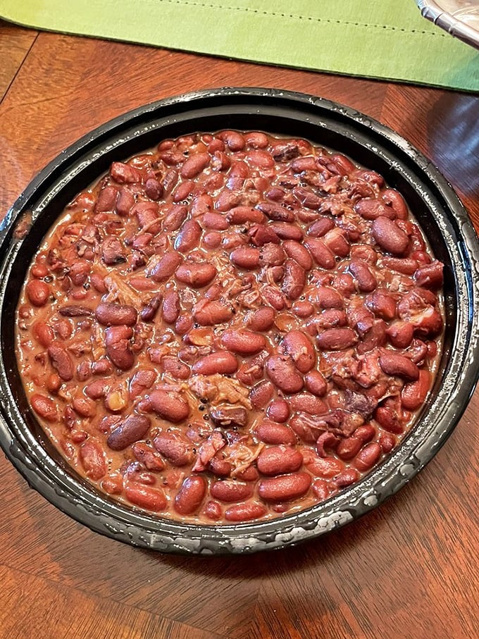 These aren't your summer cookout beans. Each spoonful delivers tender legumes swimming in a savory broth enriched by brisket trimmings&mdash;the side dish that steals the spotlight.