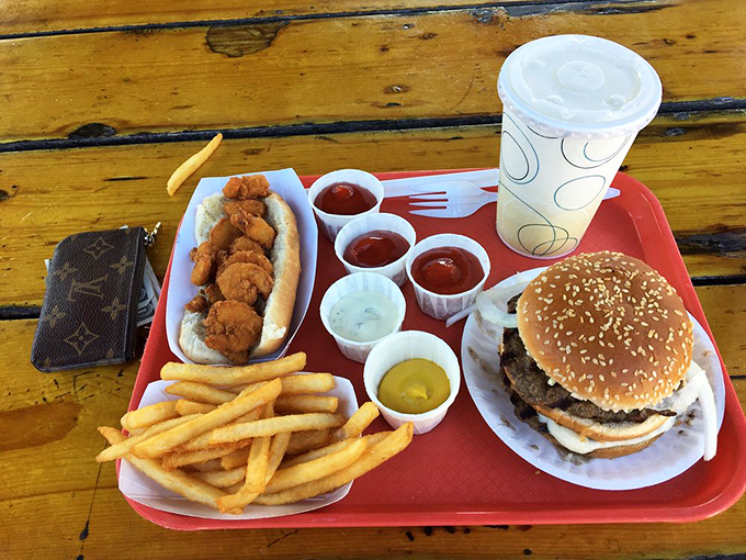 The ultimate tray of indecision: burger, seafood, and condiment cups galore. When in doubt, order everything&mdash;that's my philosophy.