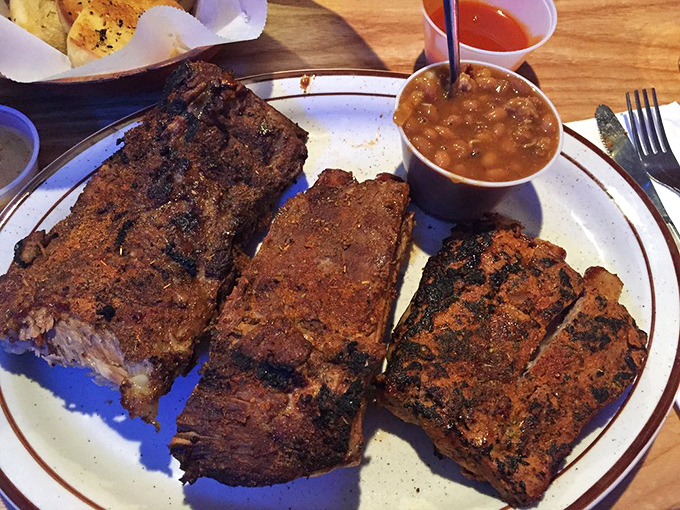 The contrast between the charred, caramelized exterior and the tender meat within is the barbecue equivalent of poetry. Those vegetables? A noble attempt at balance.