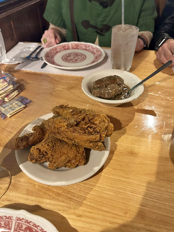 Southern diplomacy on a plate&mdash;fried chicken and country-style steak coexisting peacefully, neither willing to concede superiority.