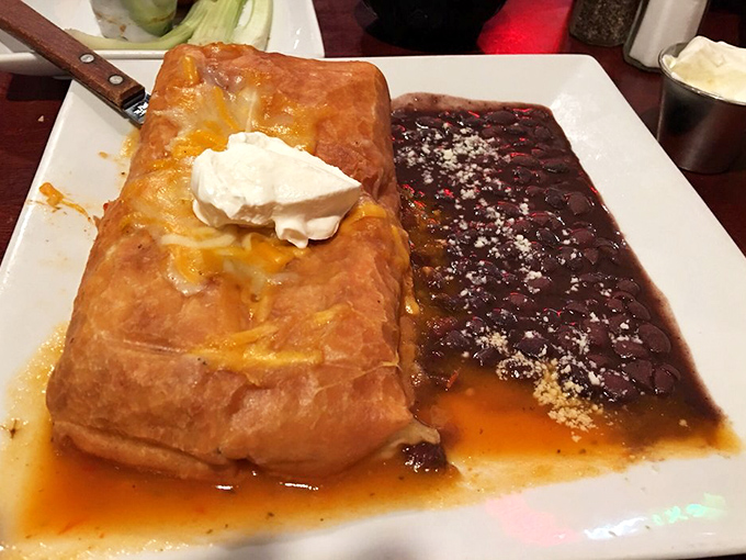 A love story on a plate: crispy chimichanga meets velvety beans in a romance that will have you planning your next visit before finishing your first bite.