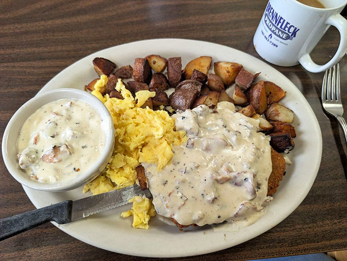 Country gravy cascading over chicken-fried steak like a delicious waterfall. This plate doesn't just feed you; it hugs you from the inside.