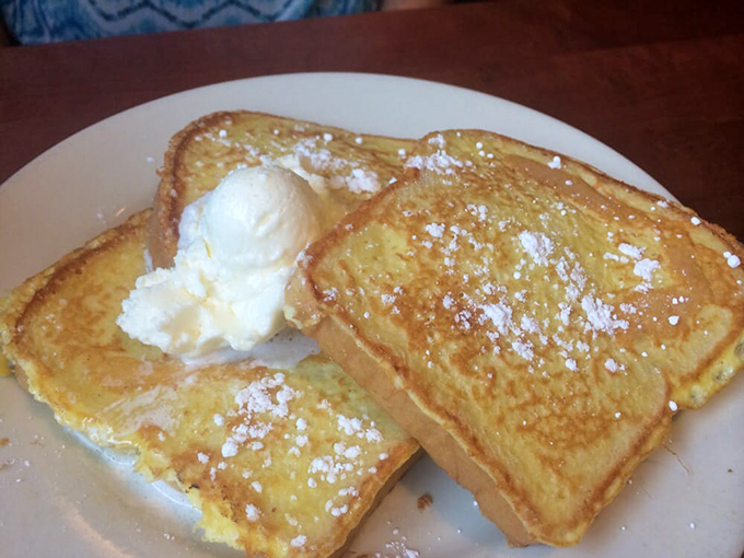 Simple pleasures done perfectly. Two slices of French toast with that magical dusting of powdered sugar&mdash;proof that breakfast doesn't need to be complicated to be extraordinary.