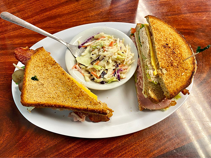 A club sandwich that stands tall and proud. The coleslaw side isn't an afterthought&mdash;it's the refreshing counterpoint this classic deserves.