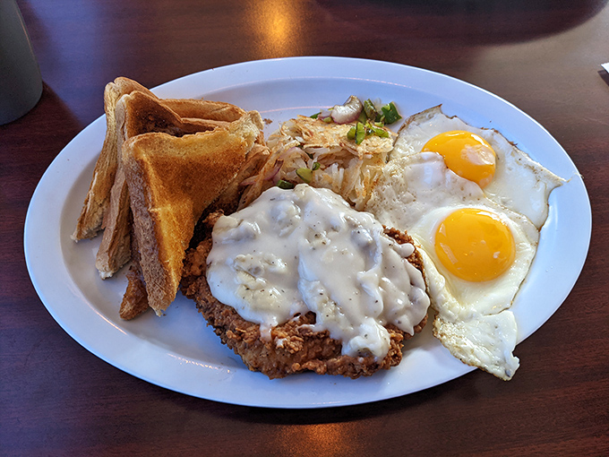 The breakfast of champions isn't some wheat flake nonsense&mdash;it's this country fried steak with sunny-side-up eggs that whisper, "Today's gonna be alright."