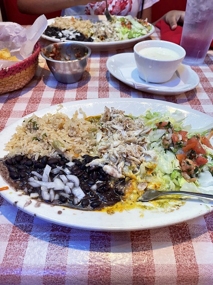 Black beans, perfectly fluffy rice, and enchiladas generously blanketed with cheese&mdash;a comfort food trifecta that transcends cultural boundaries and satisfies soul-deep hunger.