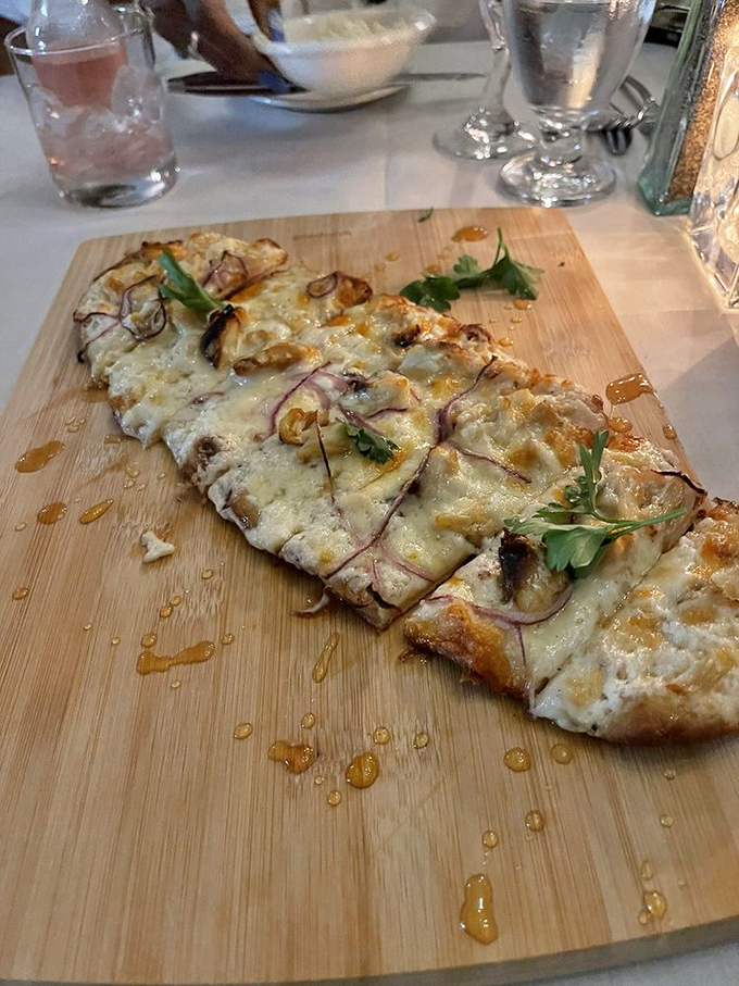 Flatbread that's dressed better than most people at formal events. The honey drizzle creates that sweet-savory magic that haunts dreams.