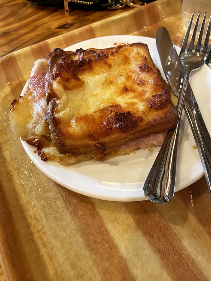 This Croque Monsieur isn't just melted cheese on bread; it's what grilled cheese dreams of becoming when it grows up.