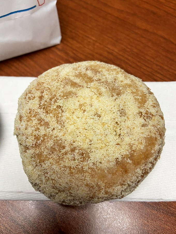 This crumb donut wears its topping like a royal crown, each buttery morsel a testament to Pennsylvania's sweet tooth.