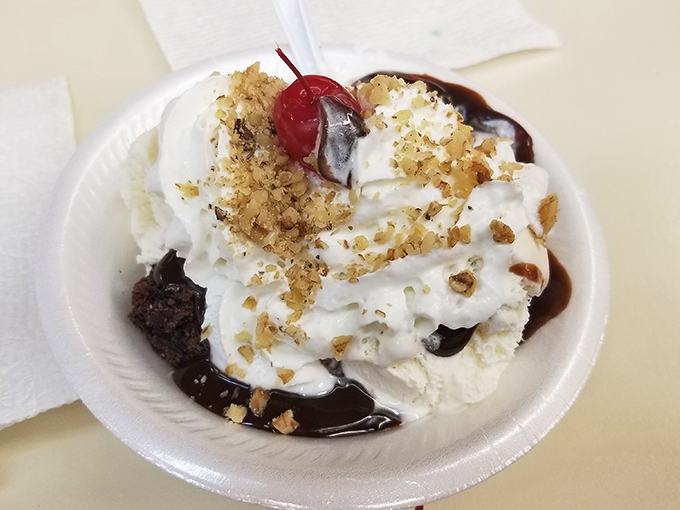 This Hot Fudge Brownie Sundae isn't just dessert, it's architectural brilliance&mdash;a foundation of brownie, pillars of cream, and a roof of walnuts. Frank Lloyd Wright would approve.