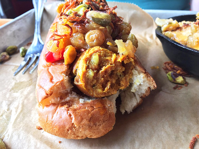 That moment when a humble sausage gets dressed up with curry sauce and becomes the street food hero we all need in our lives.