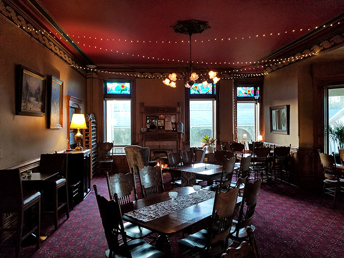 The dining room's string lights and vintage furnishings create the perfect ambiance for pretending you're at a fancy dinner party in 1922.