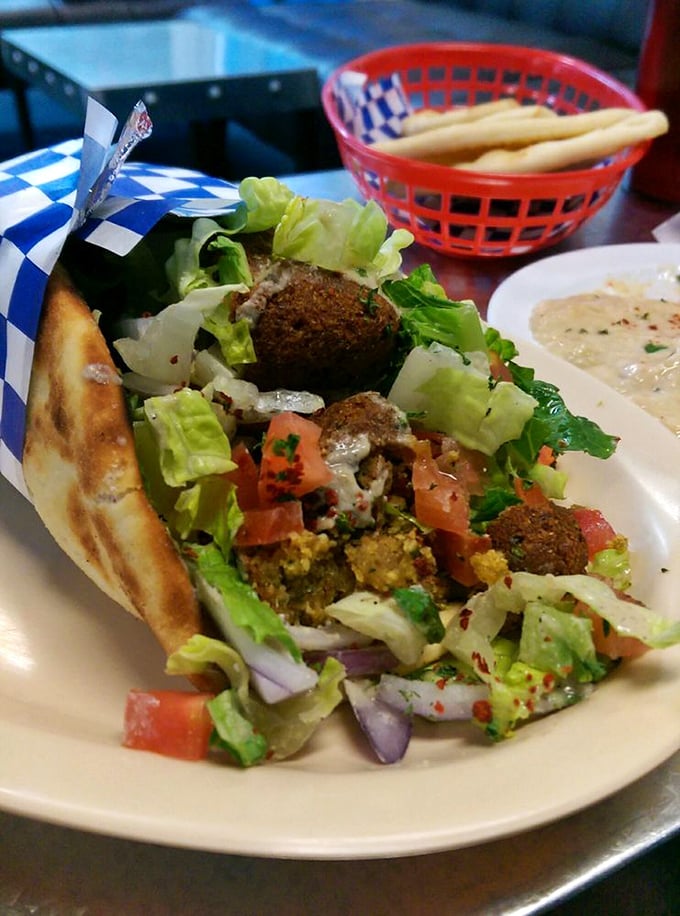 Falafel that doesn't just sit on the plate&mdash;it performs! Crispy, herb-flecked spheres nestled in fresh greens with a supporting cast of vibrant vegetables.