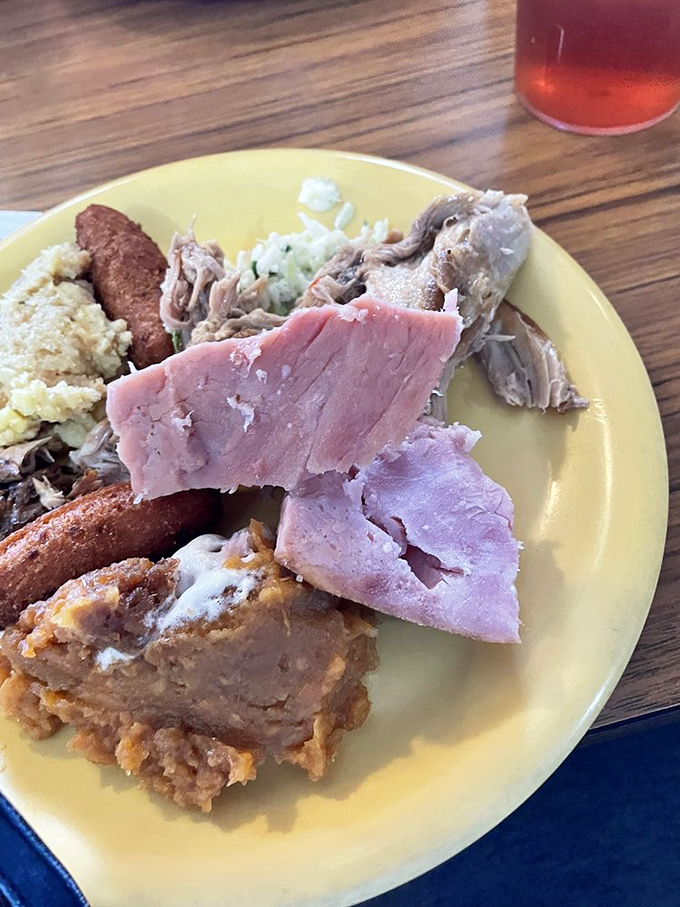 The colorful United Nations of Southern cuisine. Ham, potato salad, and fried chicken creating the kind of diplomatic relations we all appreciate.