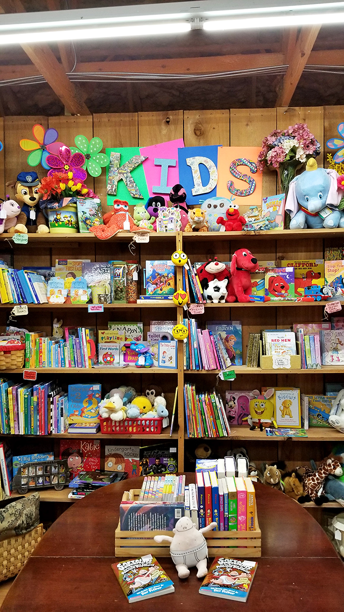 A children's corner that makes screen time seem boring by comparison. Clifford, Elmo, and friends stand guard over books that still open worlds without needing Wi-Fi.
