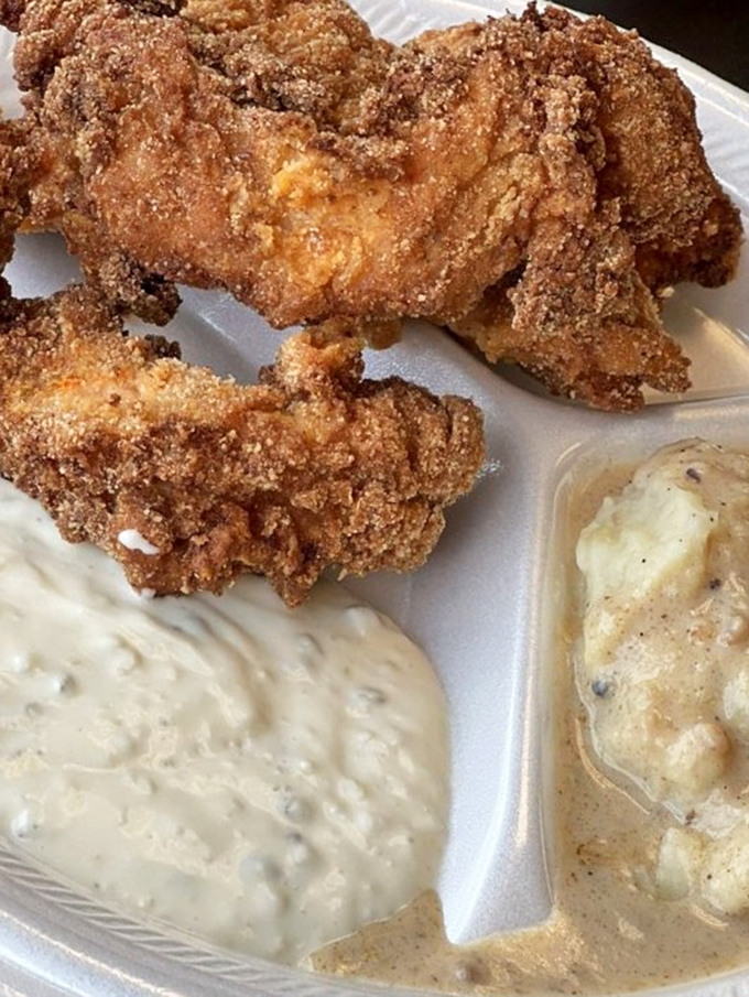 Fried chicken so perfectly golden it deserves its own trophy. The kind of crust that makes a satisfying crackle before revealing juicy meat within.