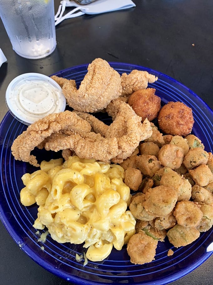 Mac and cheese that glows like liquid gold, paired with catfish that's cornmeal-kissed to perfection. The South's answer to surf and turf!